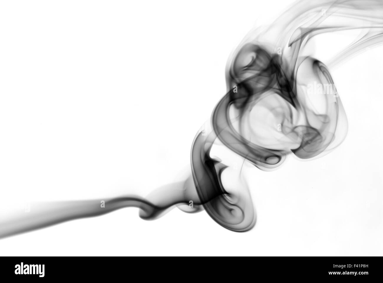 Photo of abstract curls of smoke on white background. Studio shot Stock ...