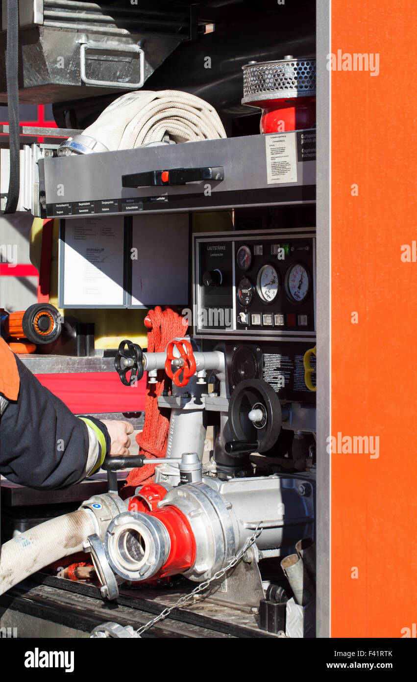 Firefighters fireman operated the fire engine Stock Photo - Alamy