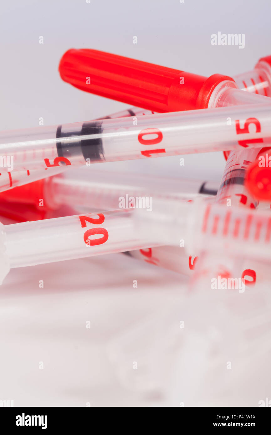 Still Life Close Up of Pile of Empty Syringe Needles with Red Safety ...