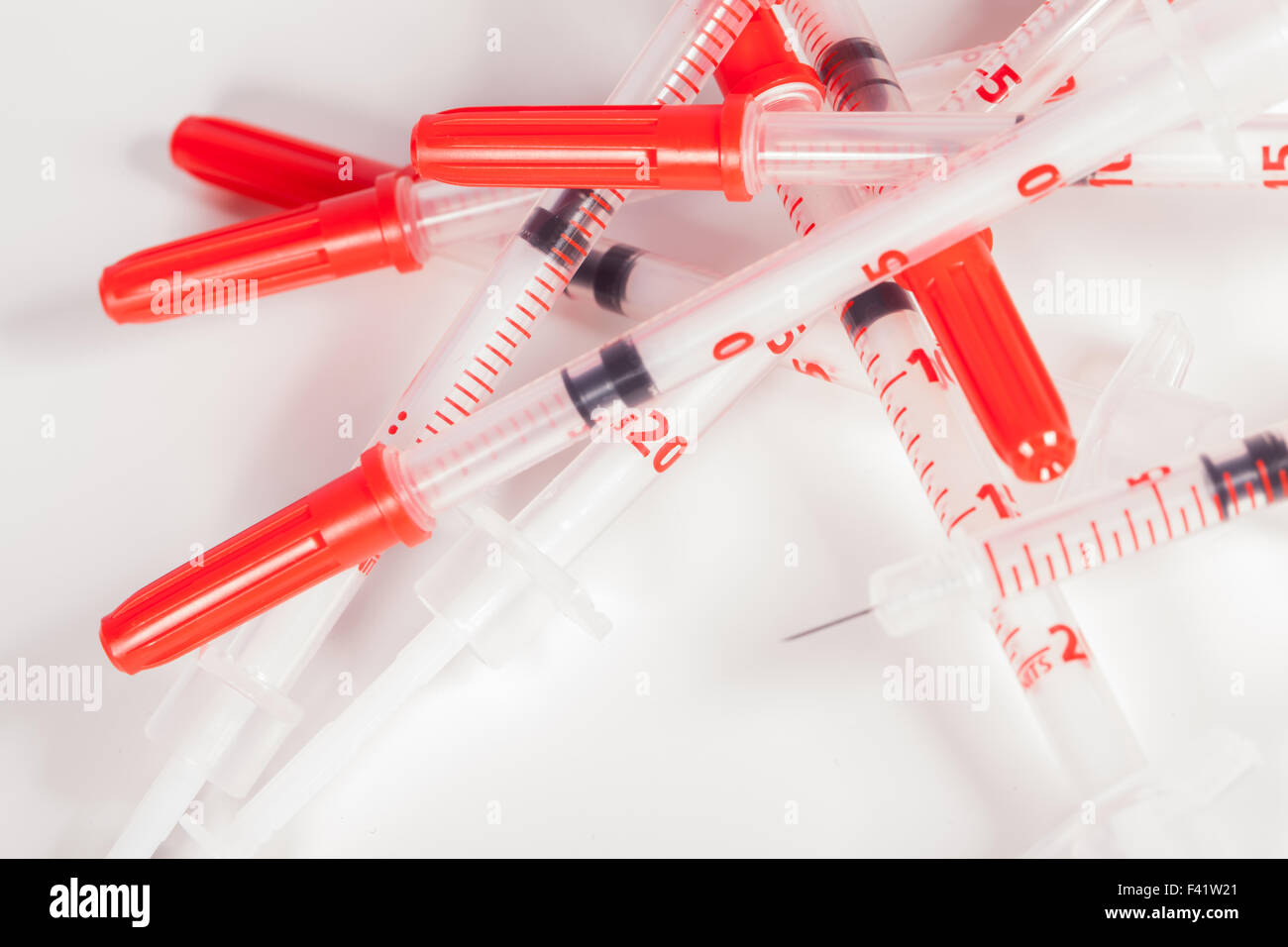 Still Life Close Up of Pile of Empty Syringe Needles with Red Safety ...