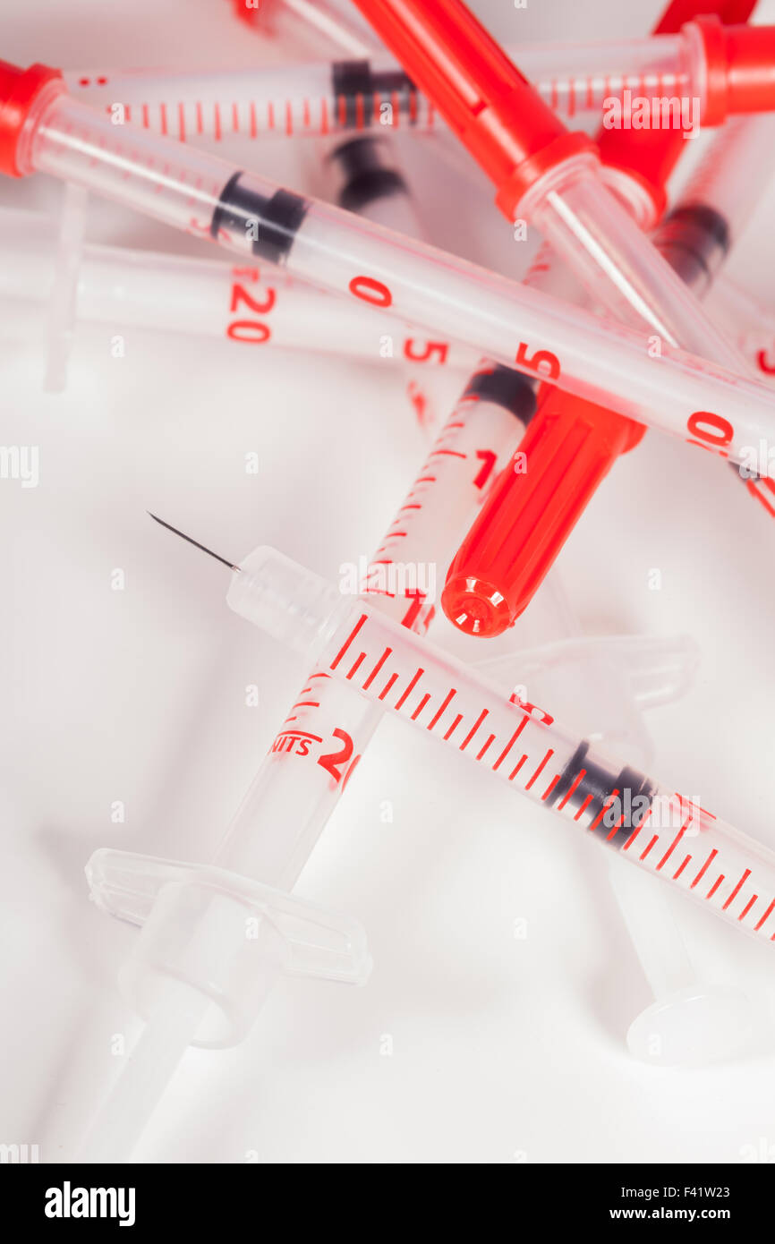 Still Life Close Up of Pile of Empty Syringe Needles with Red Safety ...