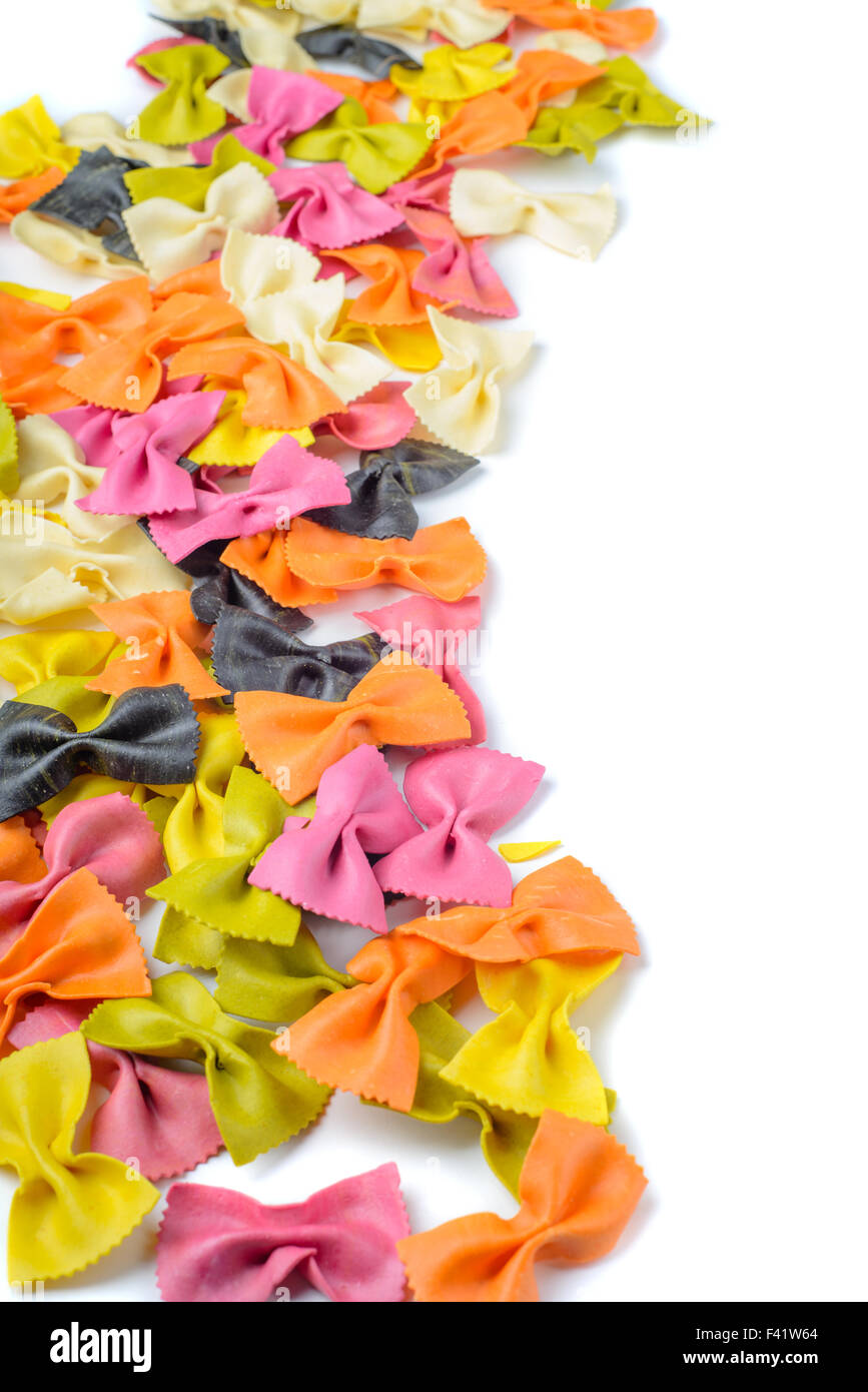 Colored farfalle pasta, on the left edge Stock Photo - Alamy