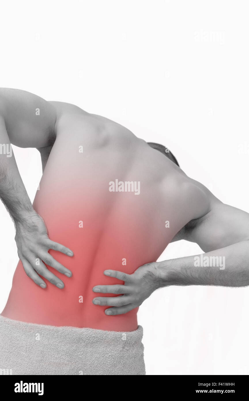 Rear view of shirtless man with back pain Stock Photo - Alamy