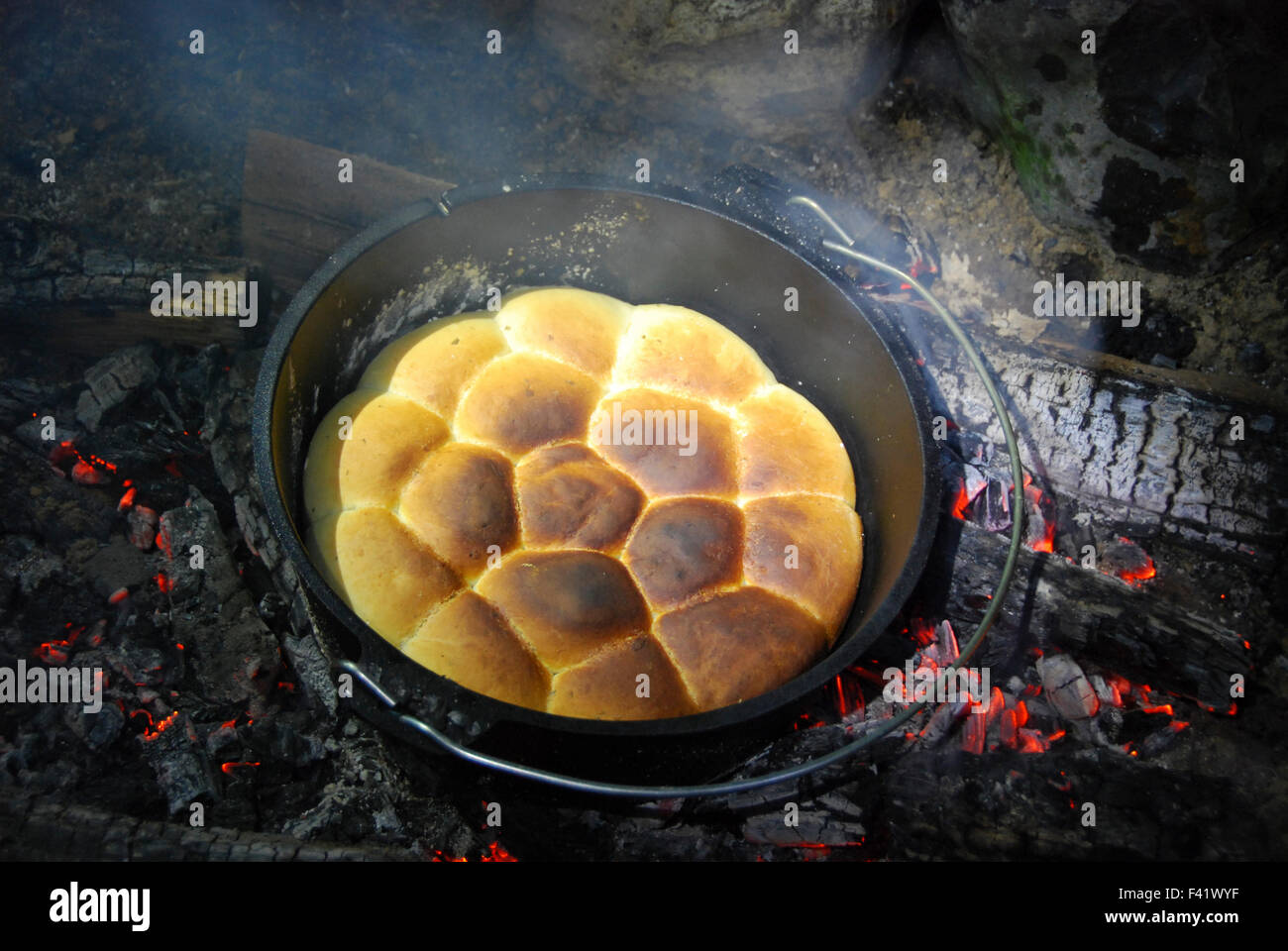 Bread in pan, cooking over open wood fire, Hamburg, Germany Stock Photo ...