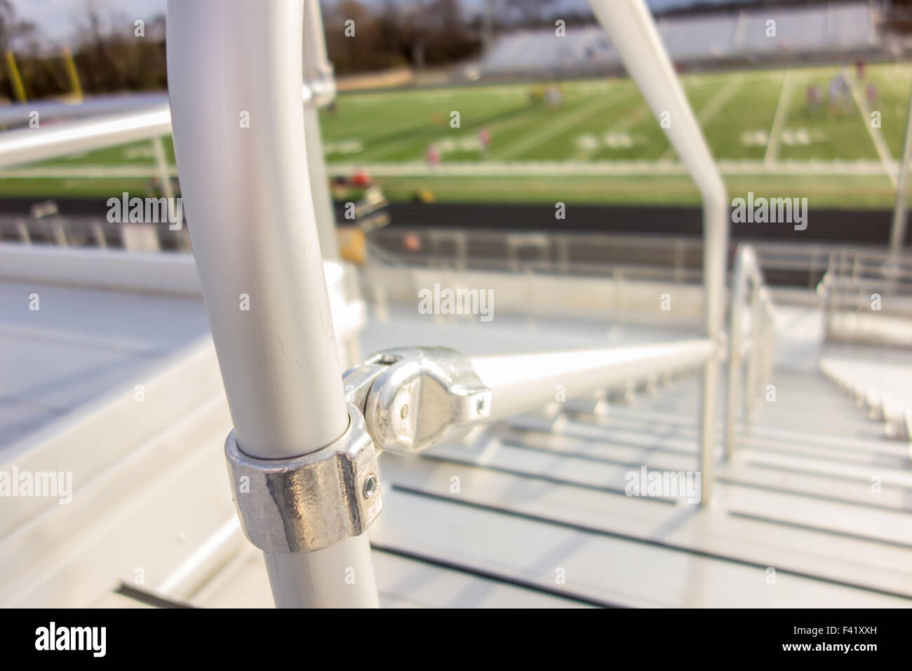 handrail connector at a sports stadium steps Stock Photo - Alamy