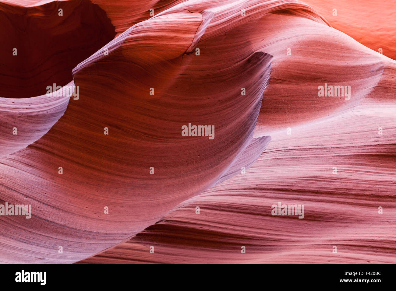 Natural erosion creates a background of colorful layered angular rock ...