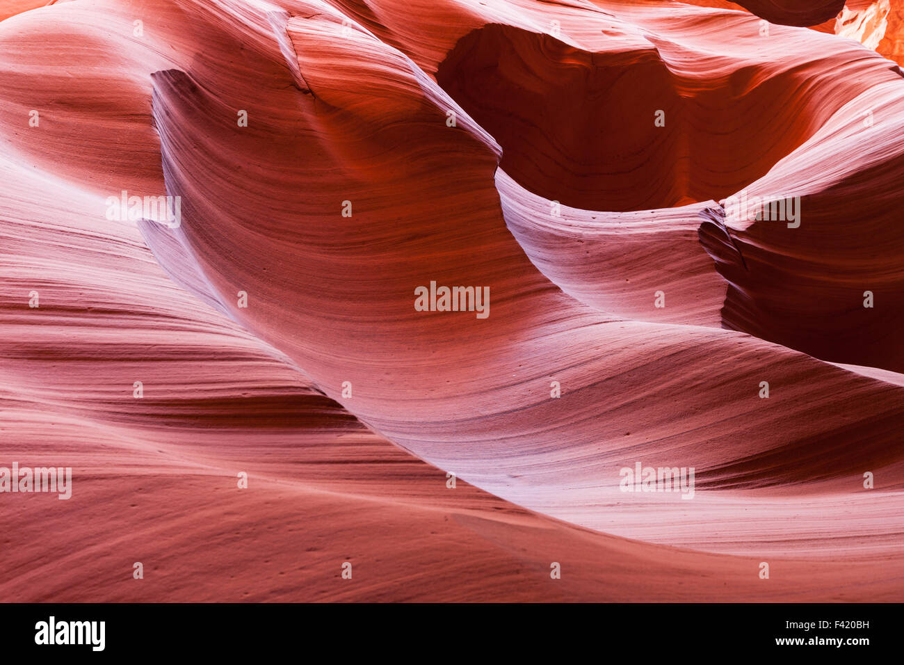 Natural erosion creates a background of colorful layered angular rock ...