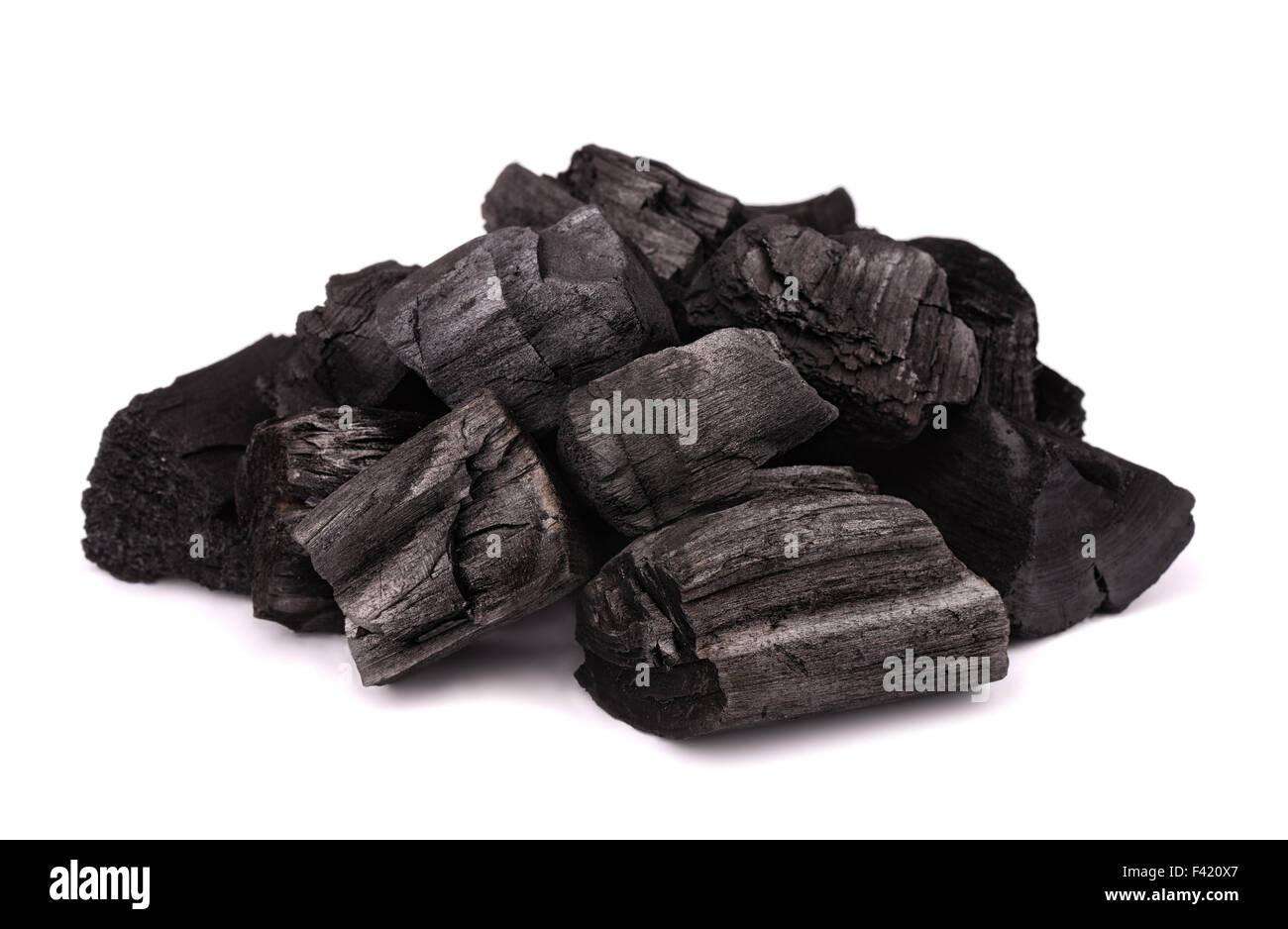 Pile of charcoal isolated on white Stock Photo - Alamy
