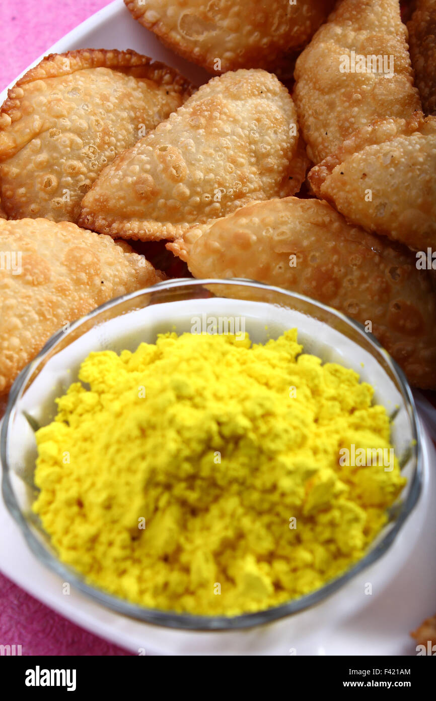 gujia in plate with holi color in bowl Stock Photo - Alamy