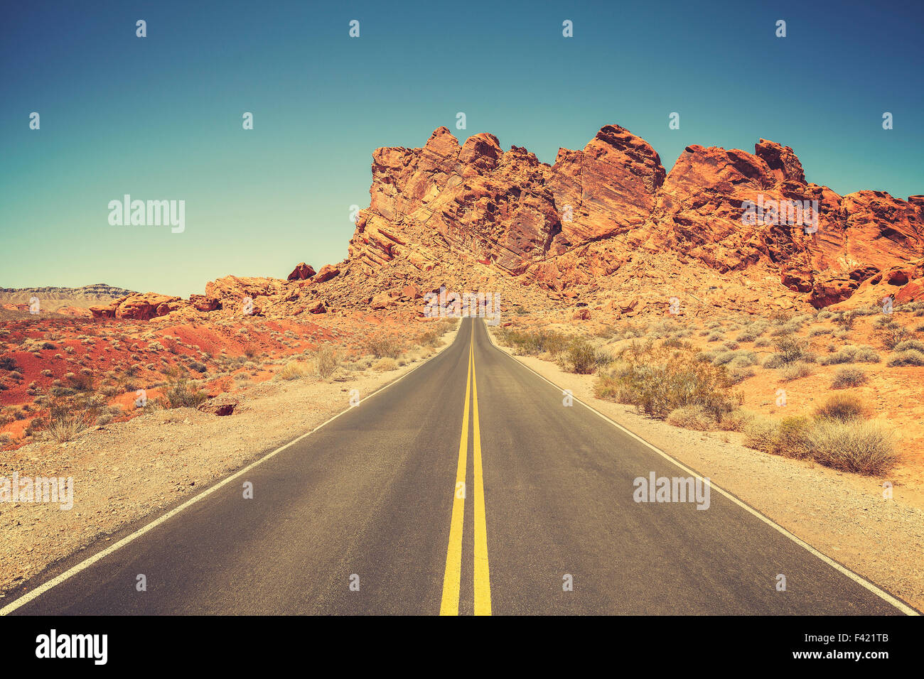 Retro stylized road through rocky desert in Valley of Fire State Park ...