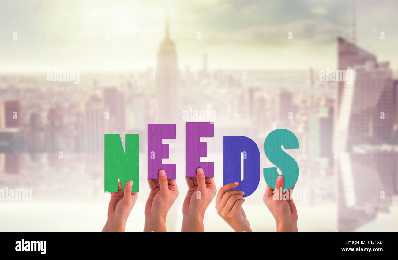 Composite image of hands holding up needs Stock Photo - Alamy