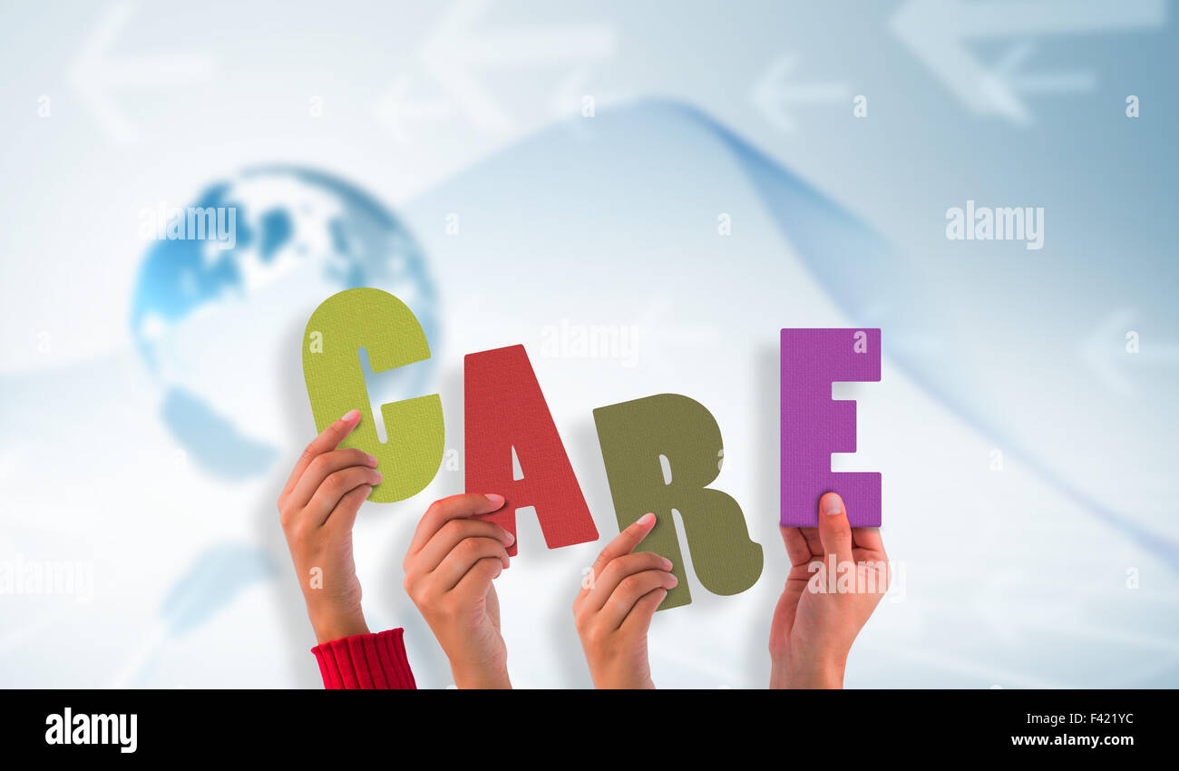 Composite image of hands holding up care Stock Photo - Alamy