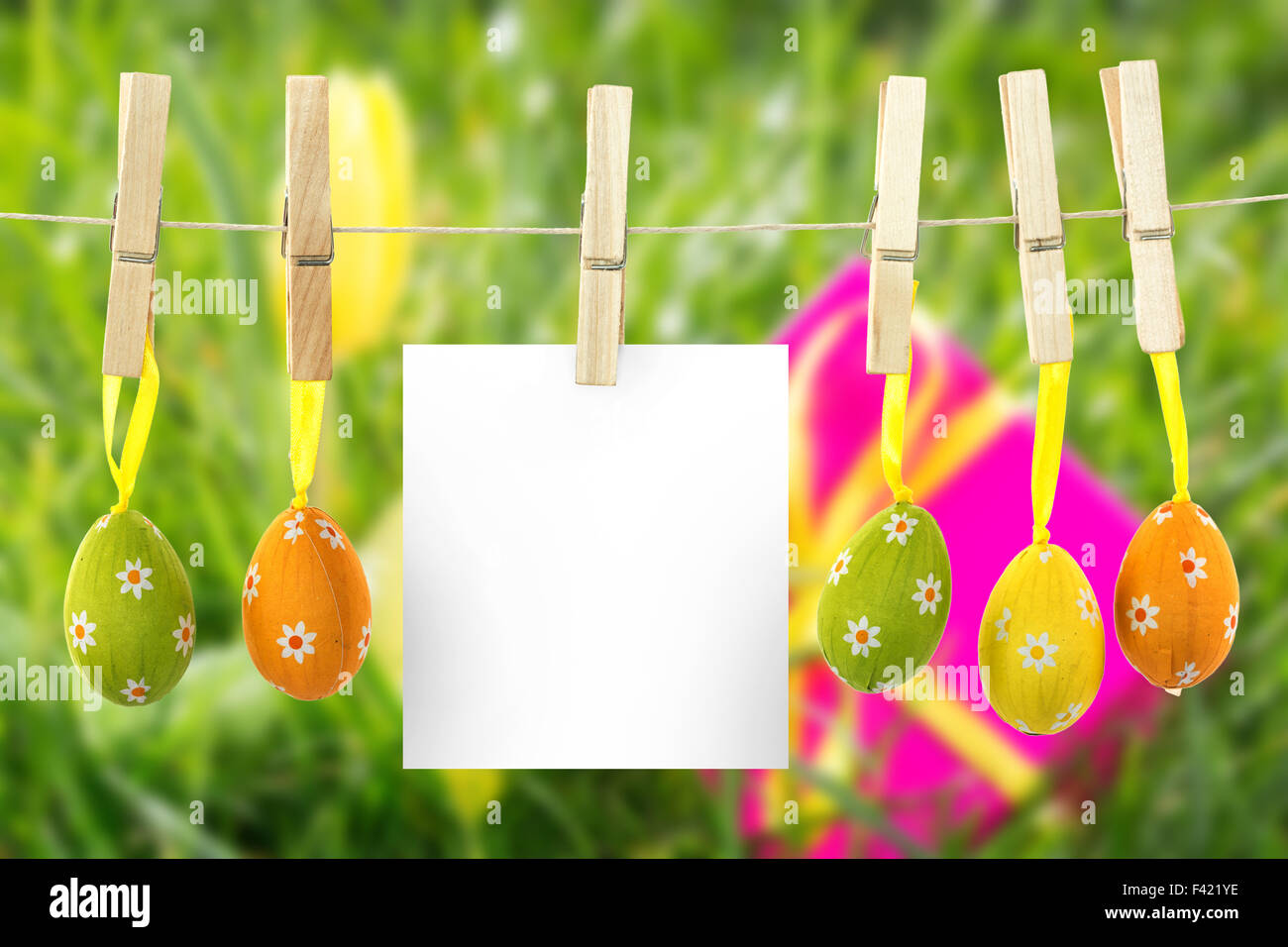 Composite image of hanging easter eggs Stock Photo - Alamy