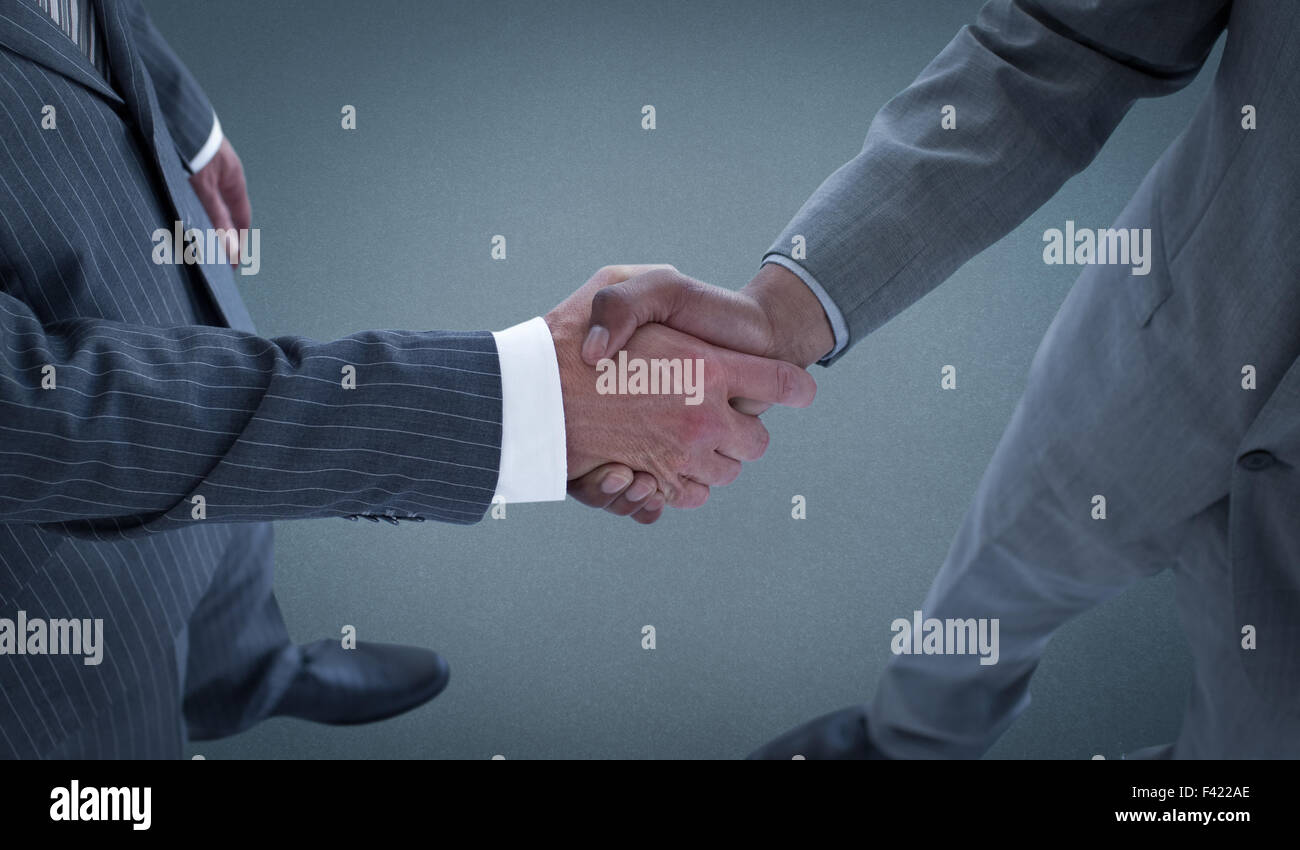 Composite image of handshake Stock Photo - Alamy
