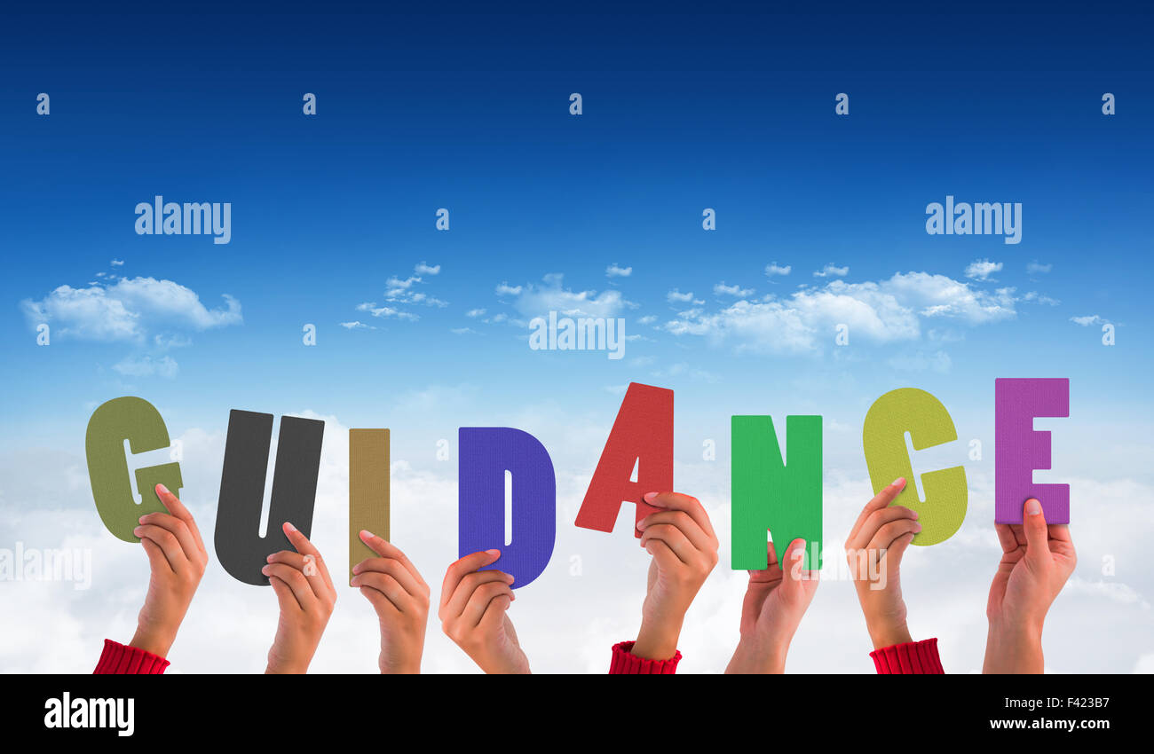 Composite image of hands holding up guidance Stock Photo - Alamy