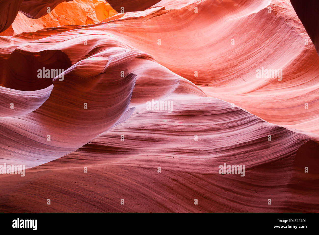 Natural erosion creates a background of colorful layered angular rock ...