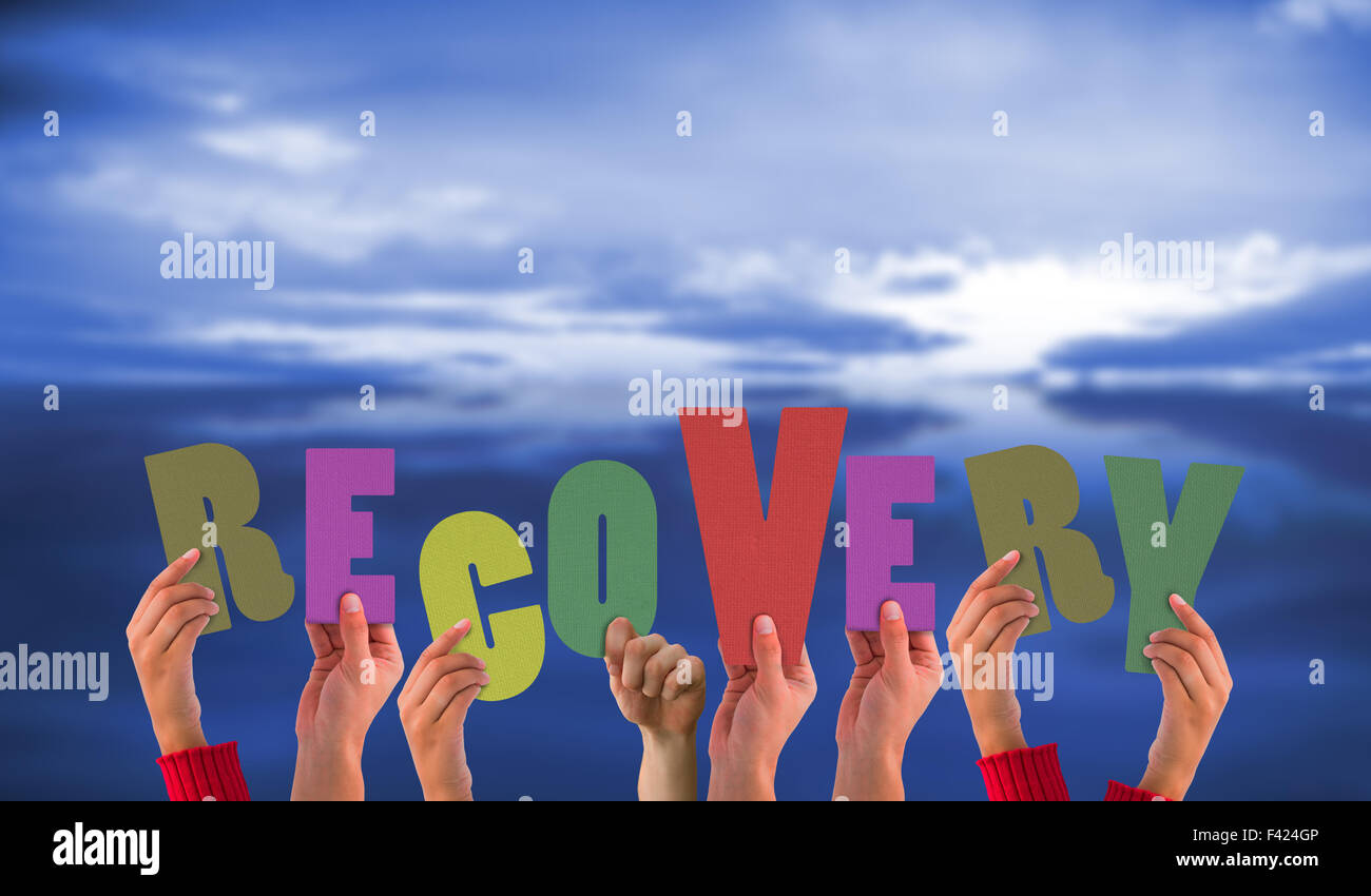 Composite image of hands holding up recovery Stock Photo - Alamy