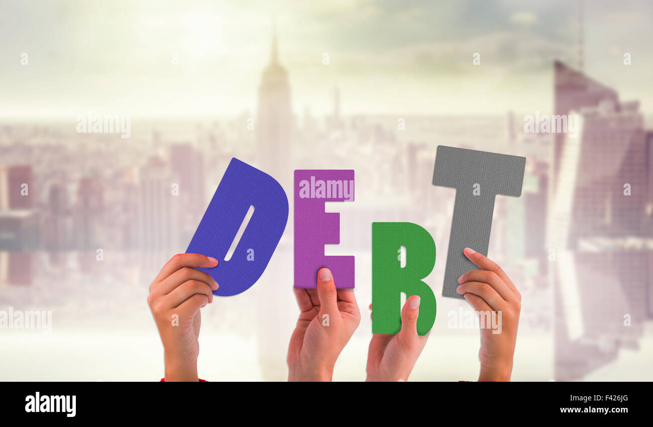 Composite image of hands holding up debt Stock Photo - Alamy