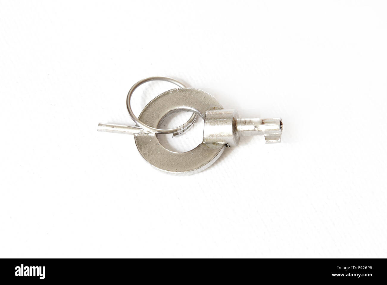 key for handcuffs closeup on white symbol of freedom Stock Photo - Alamy