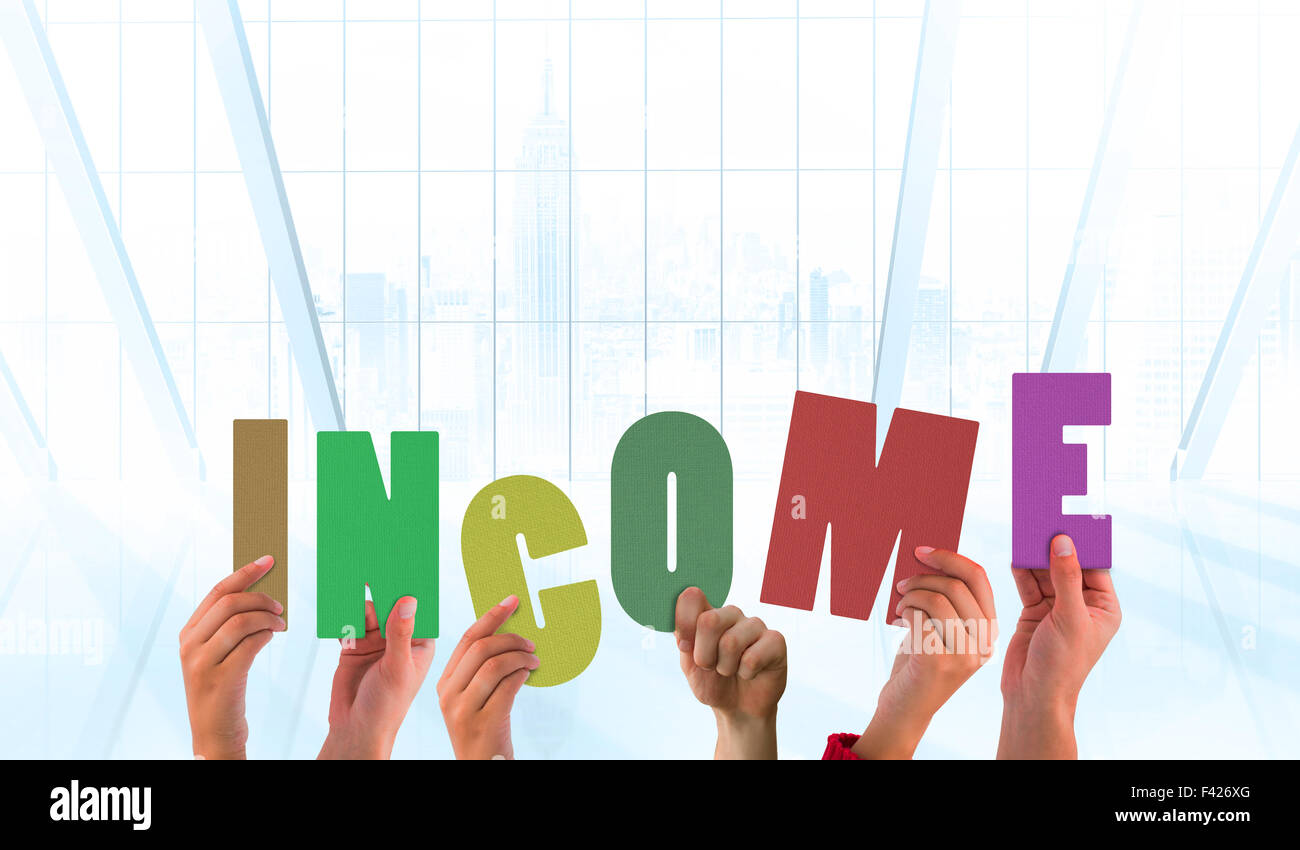 Composite image of hands holding up income Stock Photo - Alamy