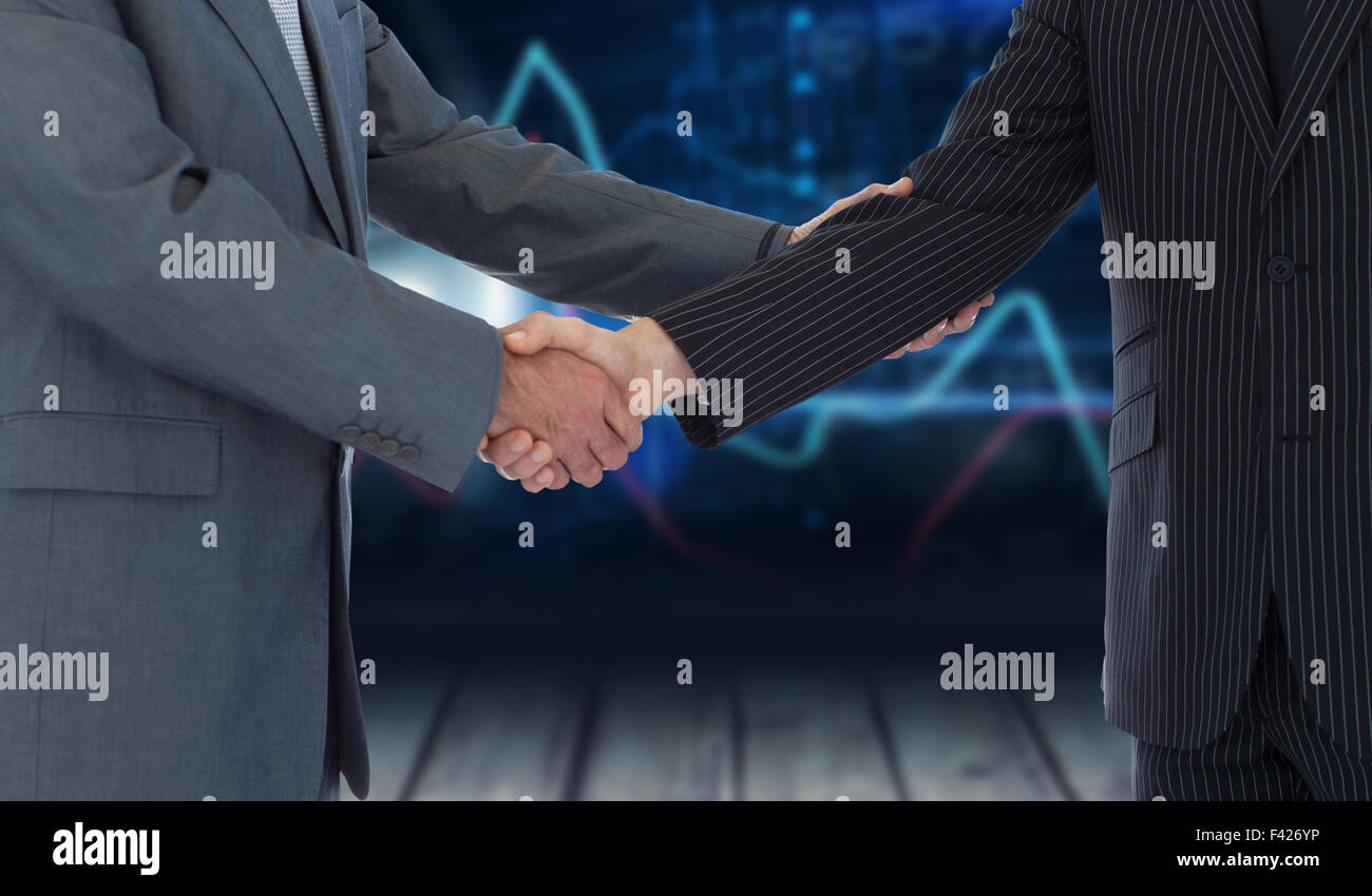 Composite image of handshake in agreement Stock Photo - Alamy