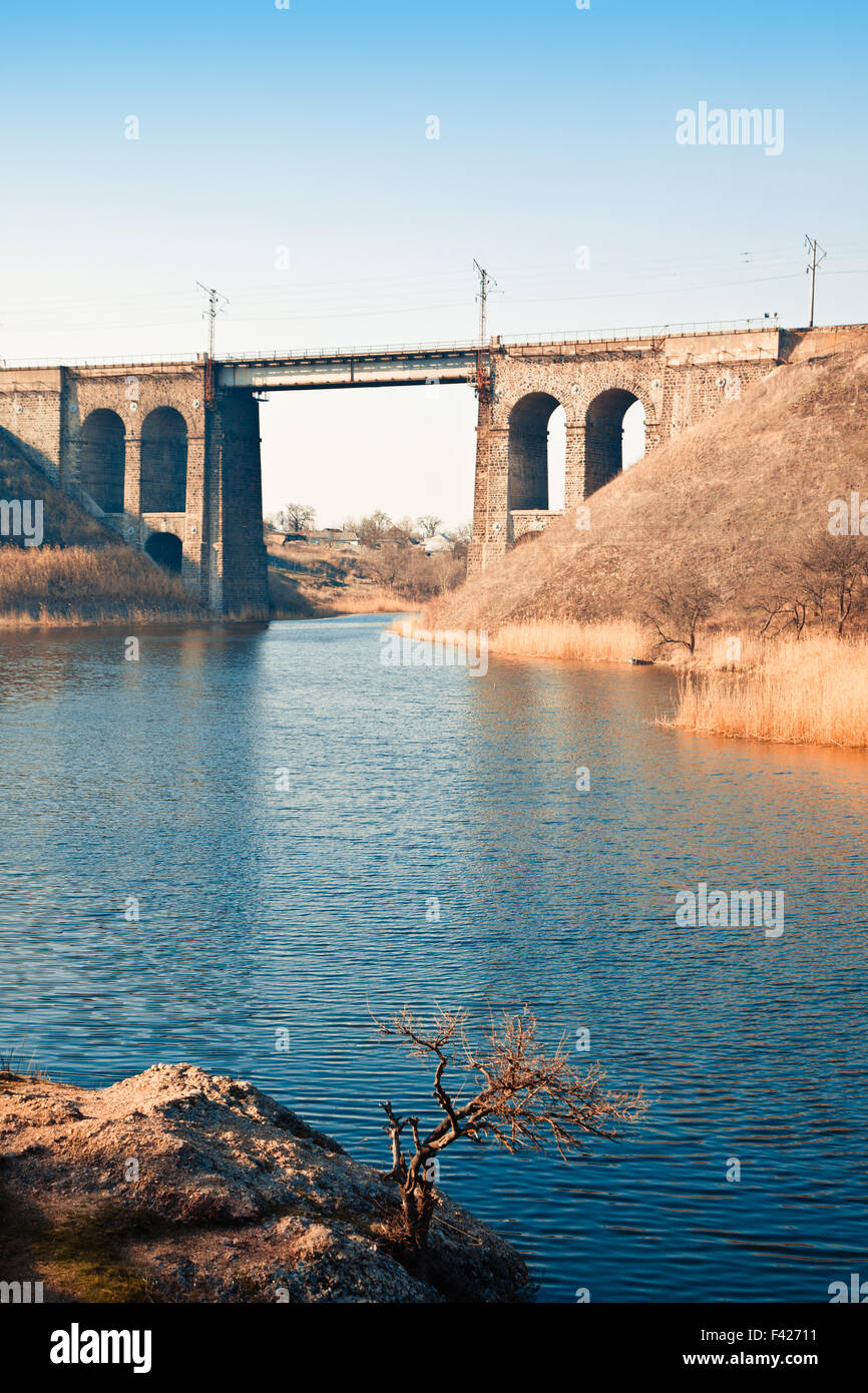 Very old stone bridge over the river Stock Photo - Alamy