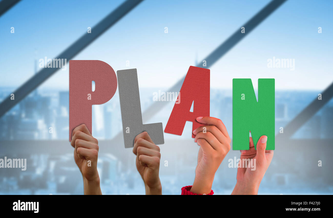 Composite image of hands showing plan Stock Photo - Alamy