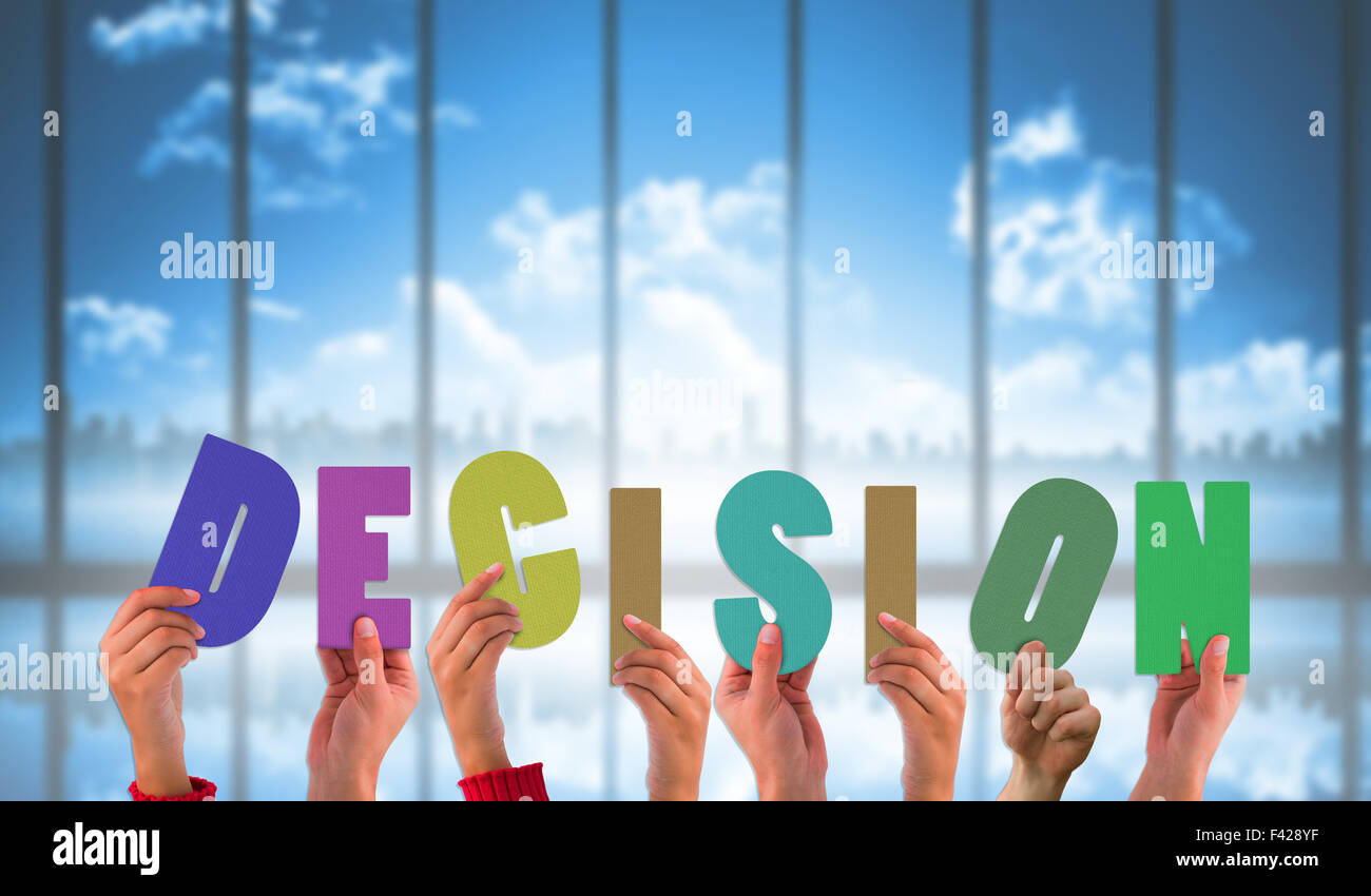 Composite image of hands holding up decision Stock Photo - Alamy