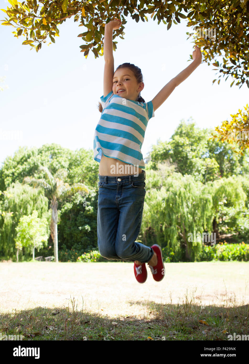 Cute little girl jumping up Stock Photo - Alamy