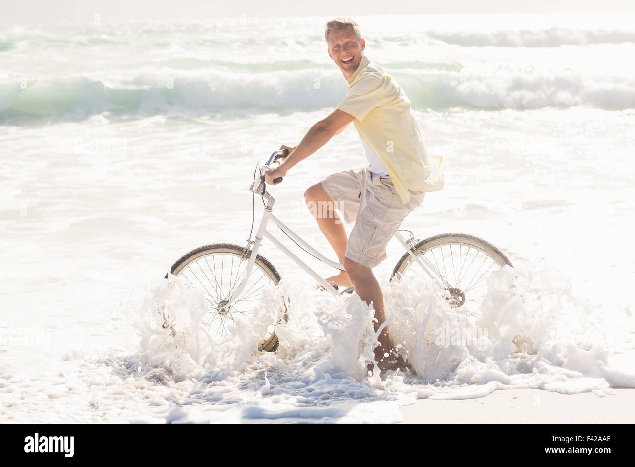 Happy man on a bike ride Stock Photo - Alamy