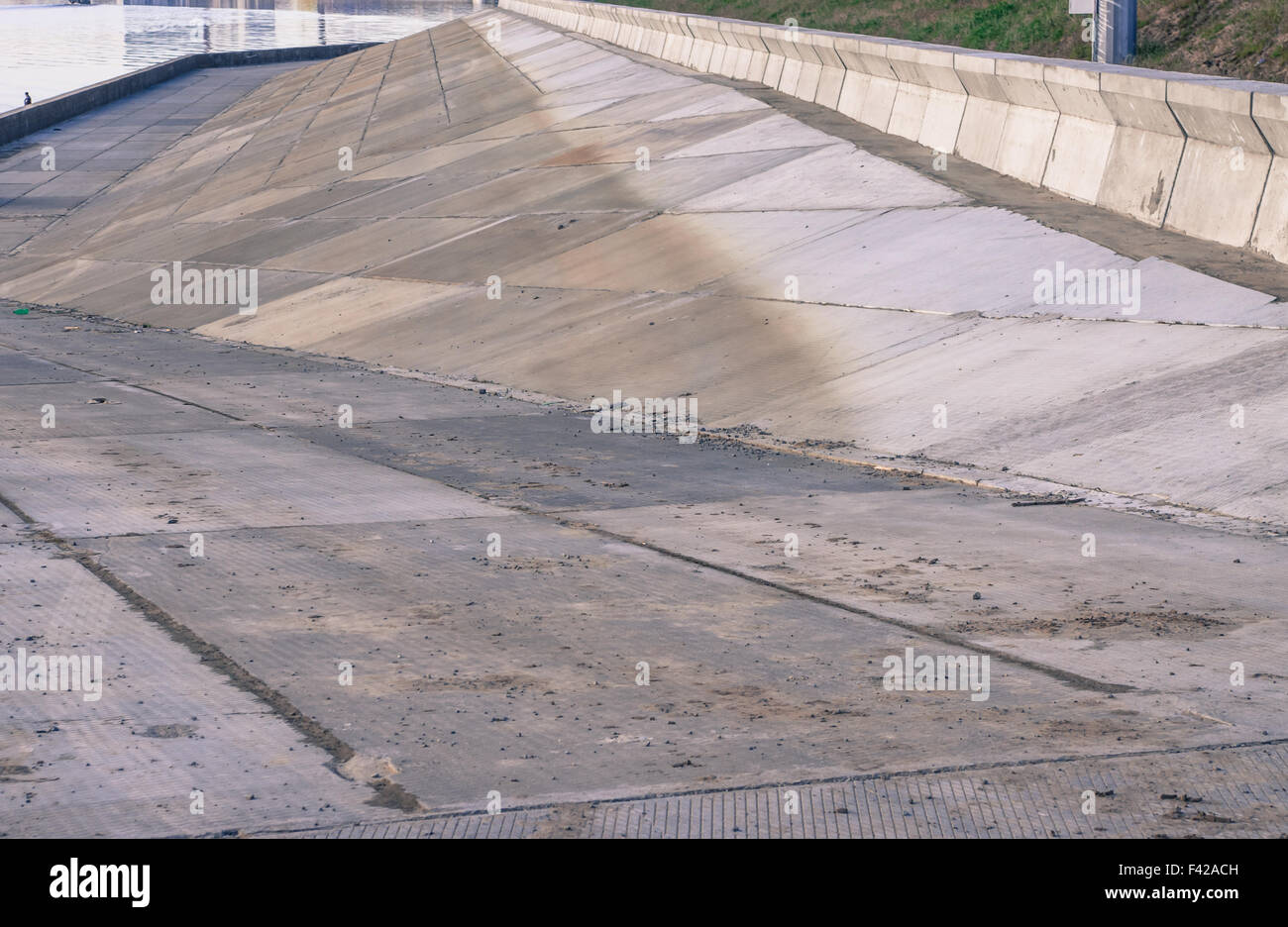 Embankment concrete slabs dam on the river Stock Photo - Alamy