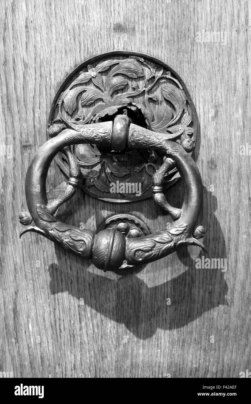 brown copper cnocker in a door in innsbruck austria Stock Photo - Alamy