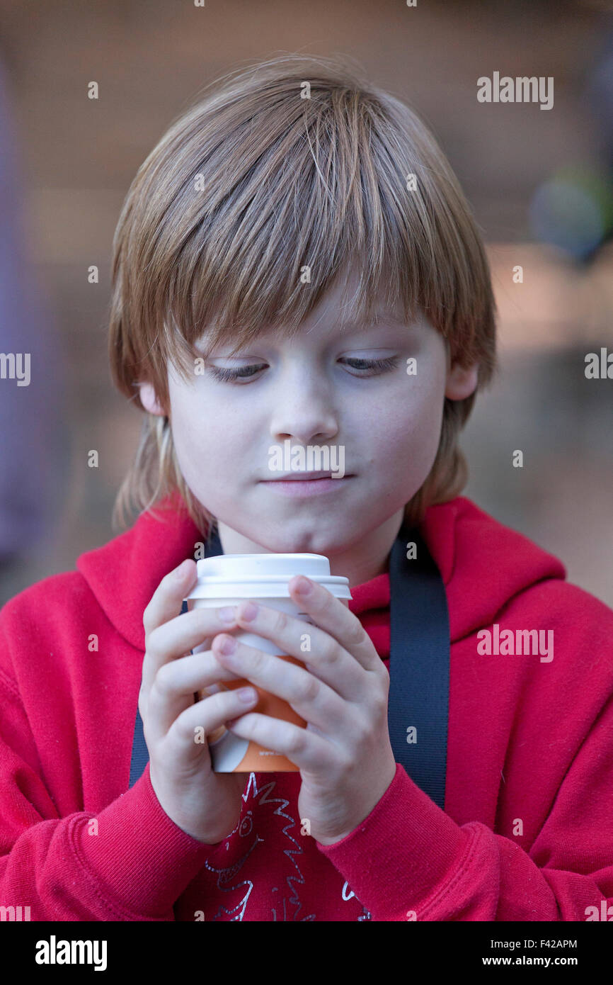 portrait of a young boy with a paper cup in his hand Stock Photo - Alamy