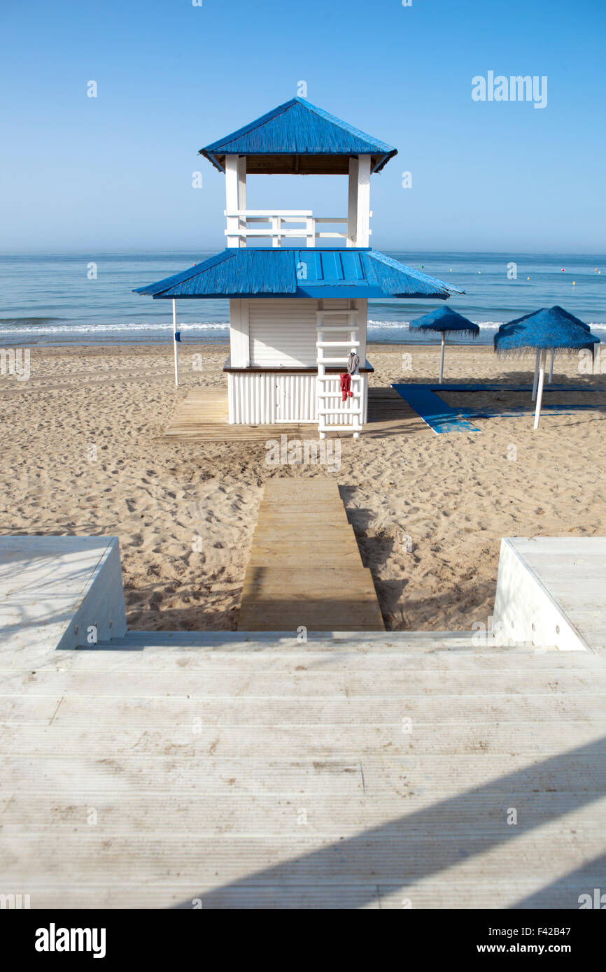 Wooden blue and white beach refreshments stand at beautiful white beach ...