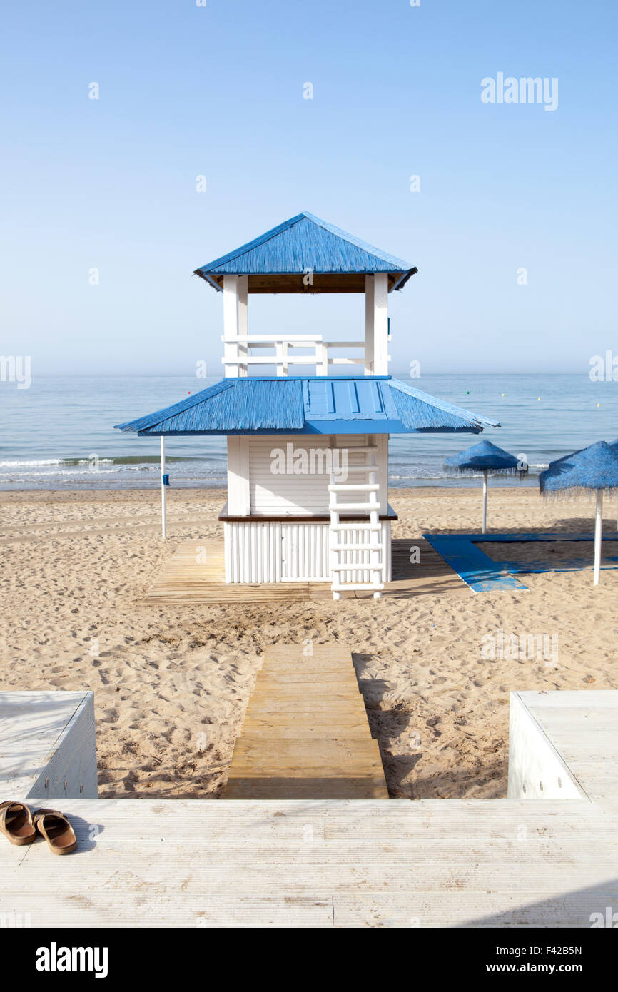 Wooden blue and white beach refreshments stand at beautiful white beach ...