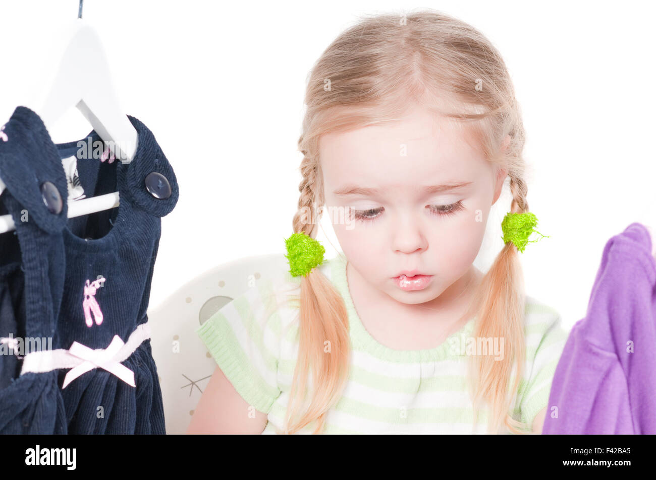 Toddler girl and clothes Stock Photo - Alamy