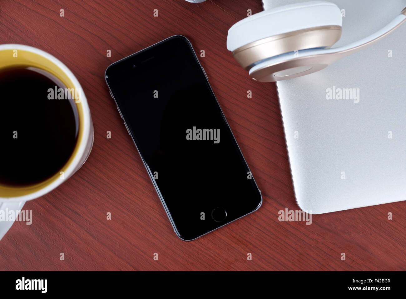 Coffee work table with mobile phone and laptop and a headphone on a ...