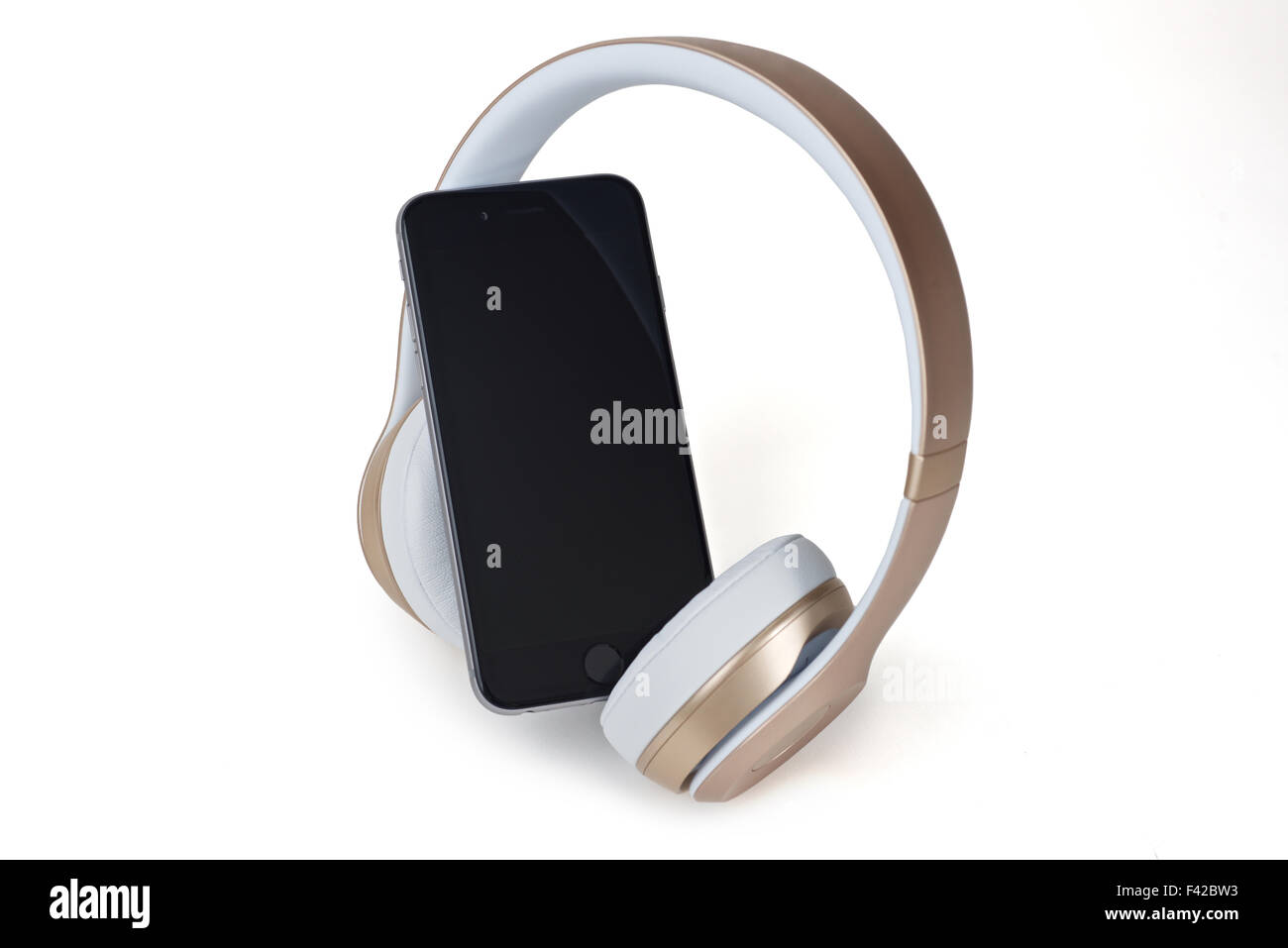 Mobile phone and headphone on white background Stock Photo - Alamy