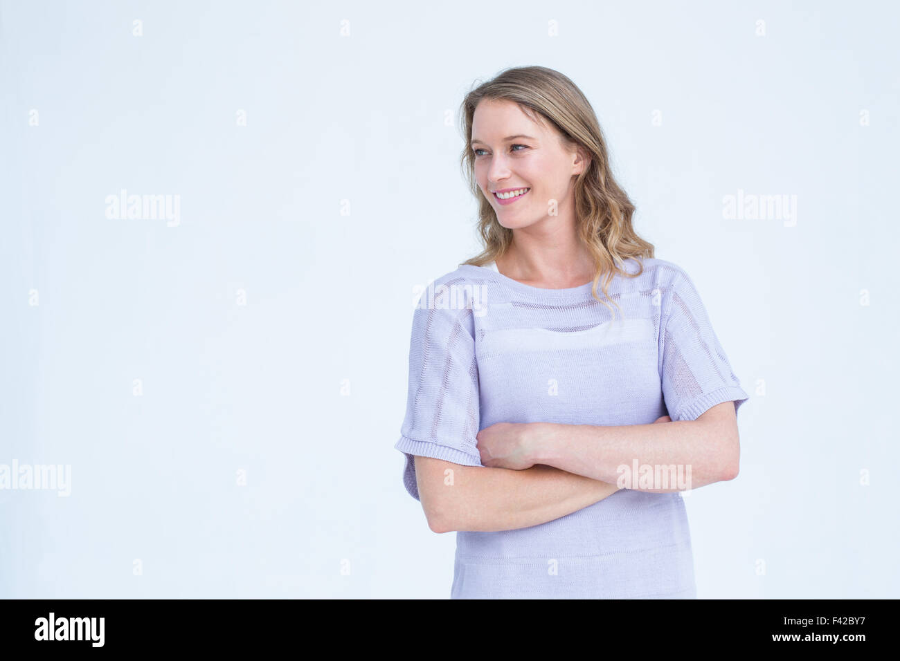 Woman standing with arms crossed Stock Photo - Alamy