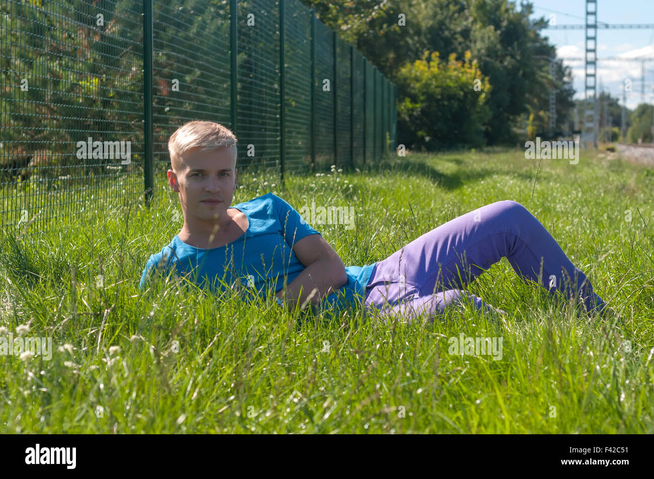 Lying down on green grass hi-res stock photography and images - Alamy