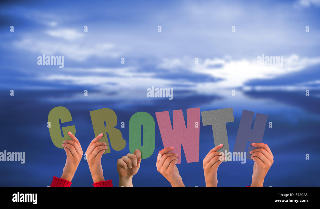 Composite image of hands showing growth Stock Photo - Alamy