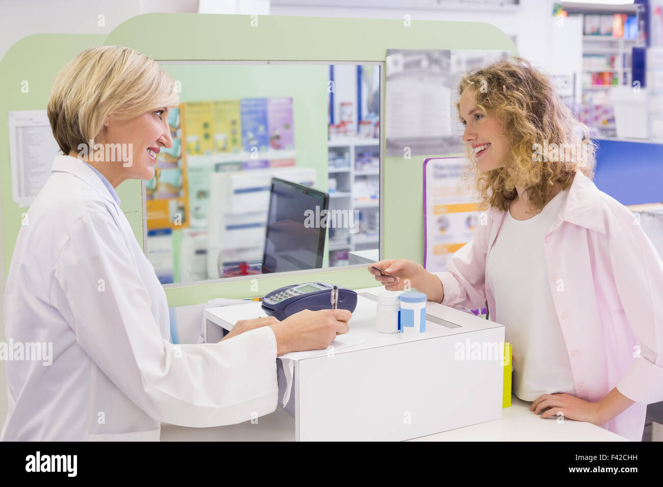Pharmacist writing prescription hi-res stock photography and images - Alamy