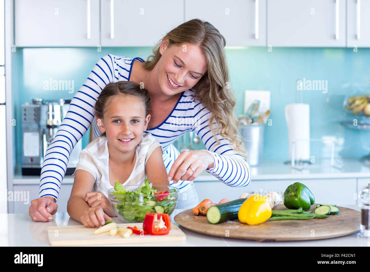 Happy family preparing lunch together Stock Photo - Alamy