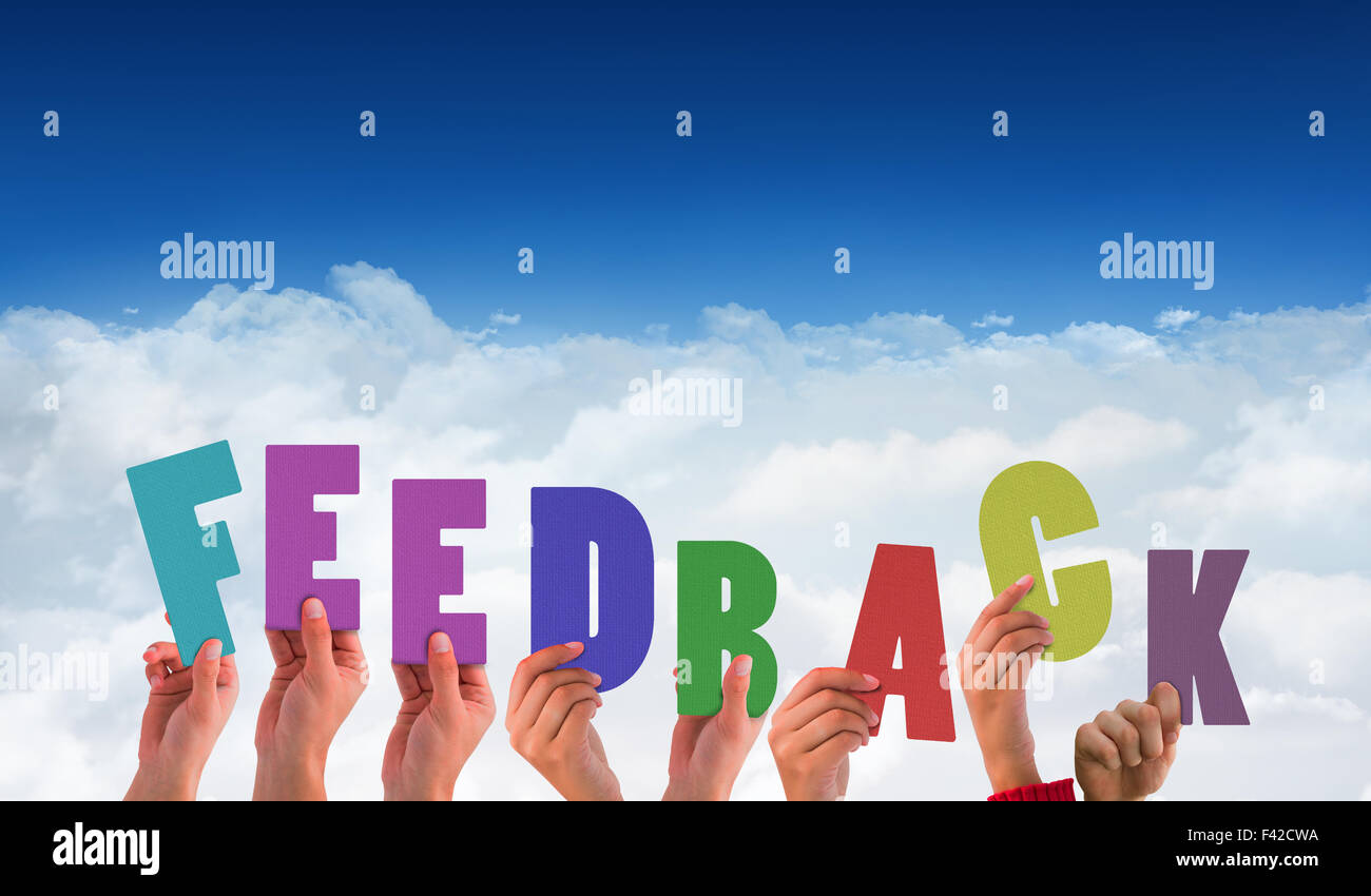 Composite image of hands holding up feedback Stock Photo - Alamy