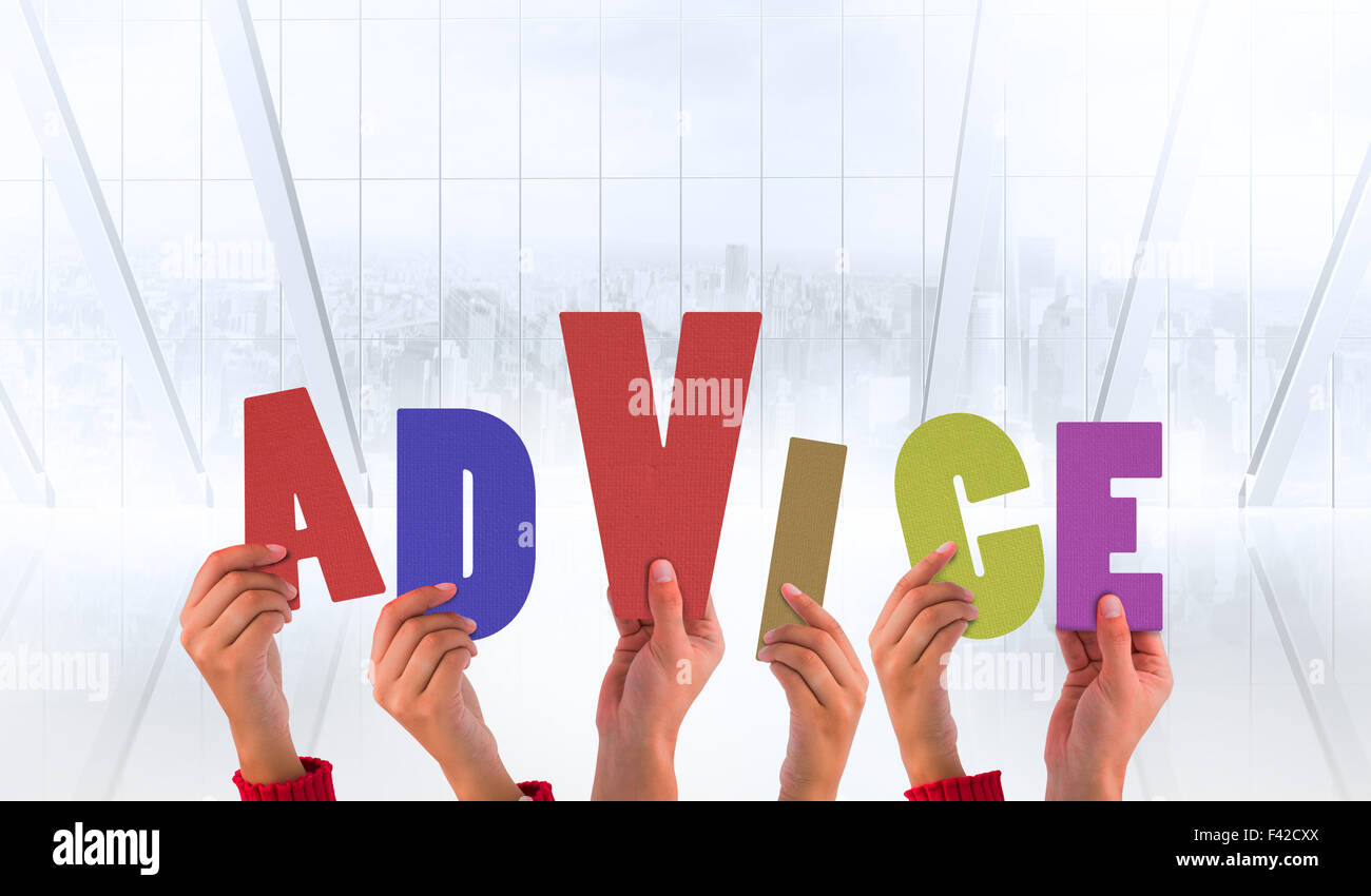 Composite image of hands holding up advice Stock Photo - Alamy