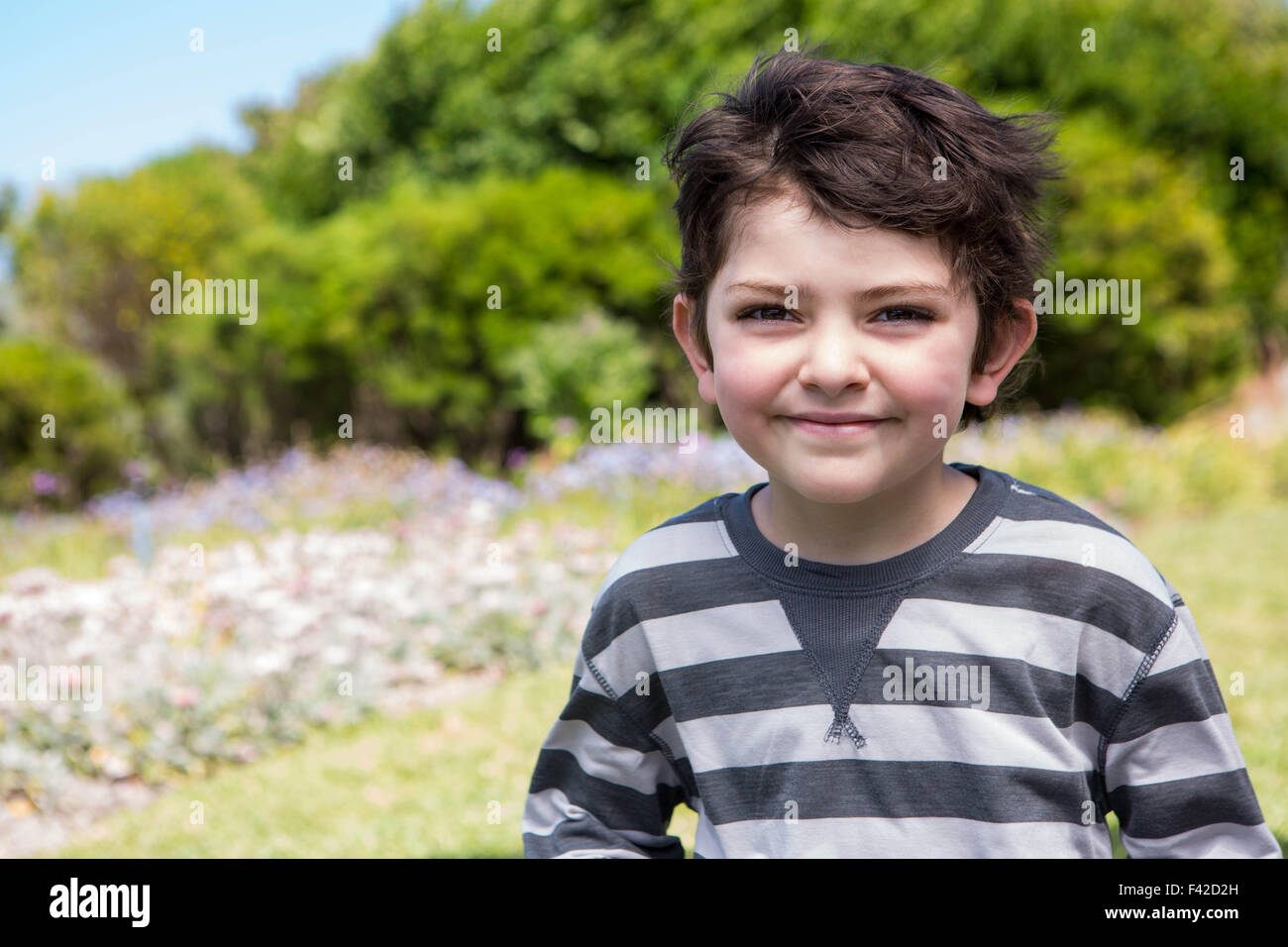 Cute boy smiling at camera Stock Photo - Alamy