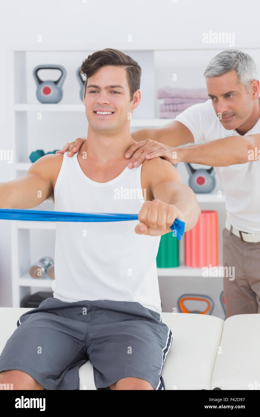 Doctor examining his patient back Stock Photo - Alamy