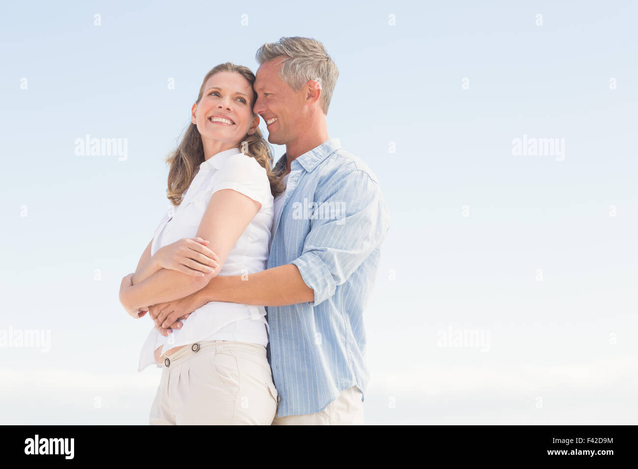 Happy couple smiling at each other Stock Photo - Alamy