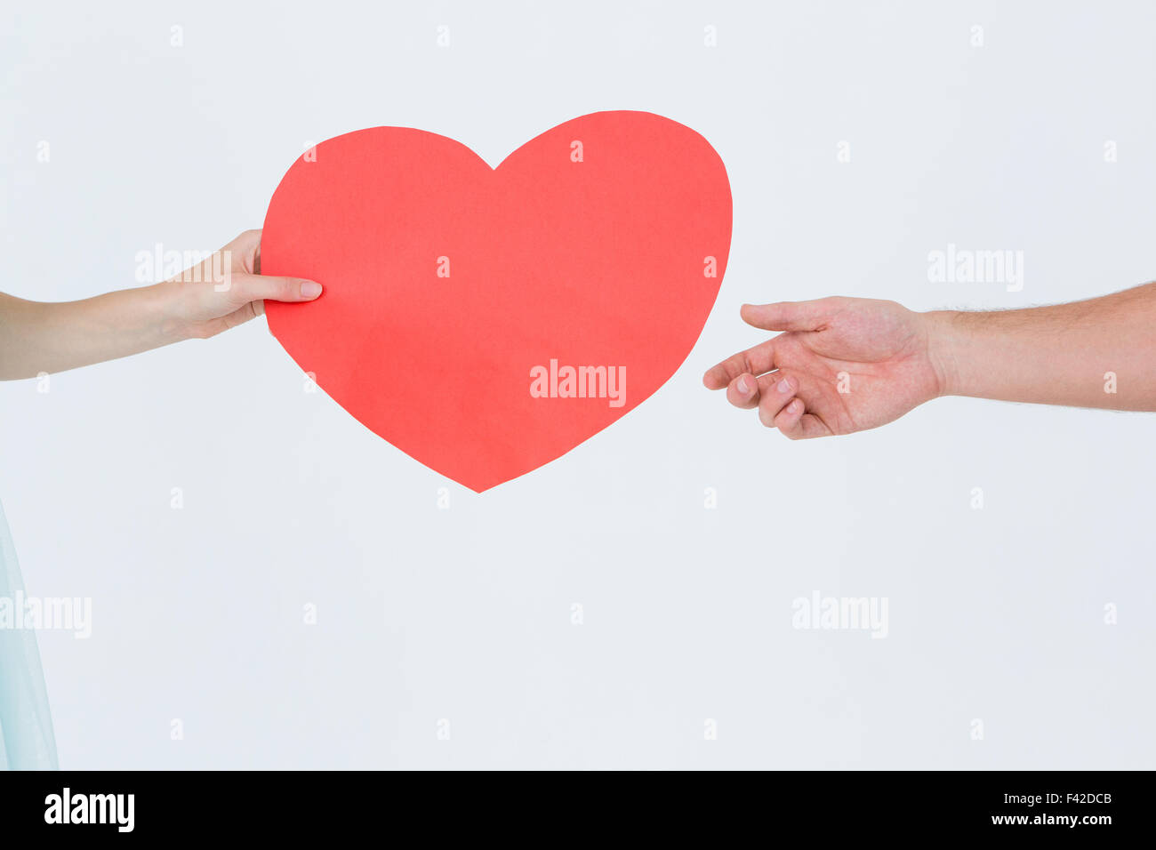 Woman giving heart card to her boyfriend Stock Photo - Alamy