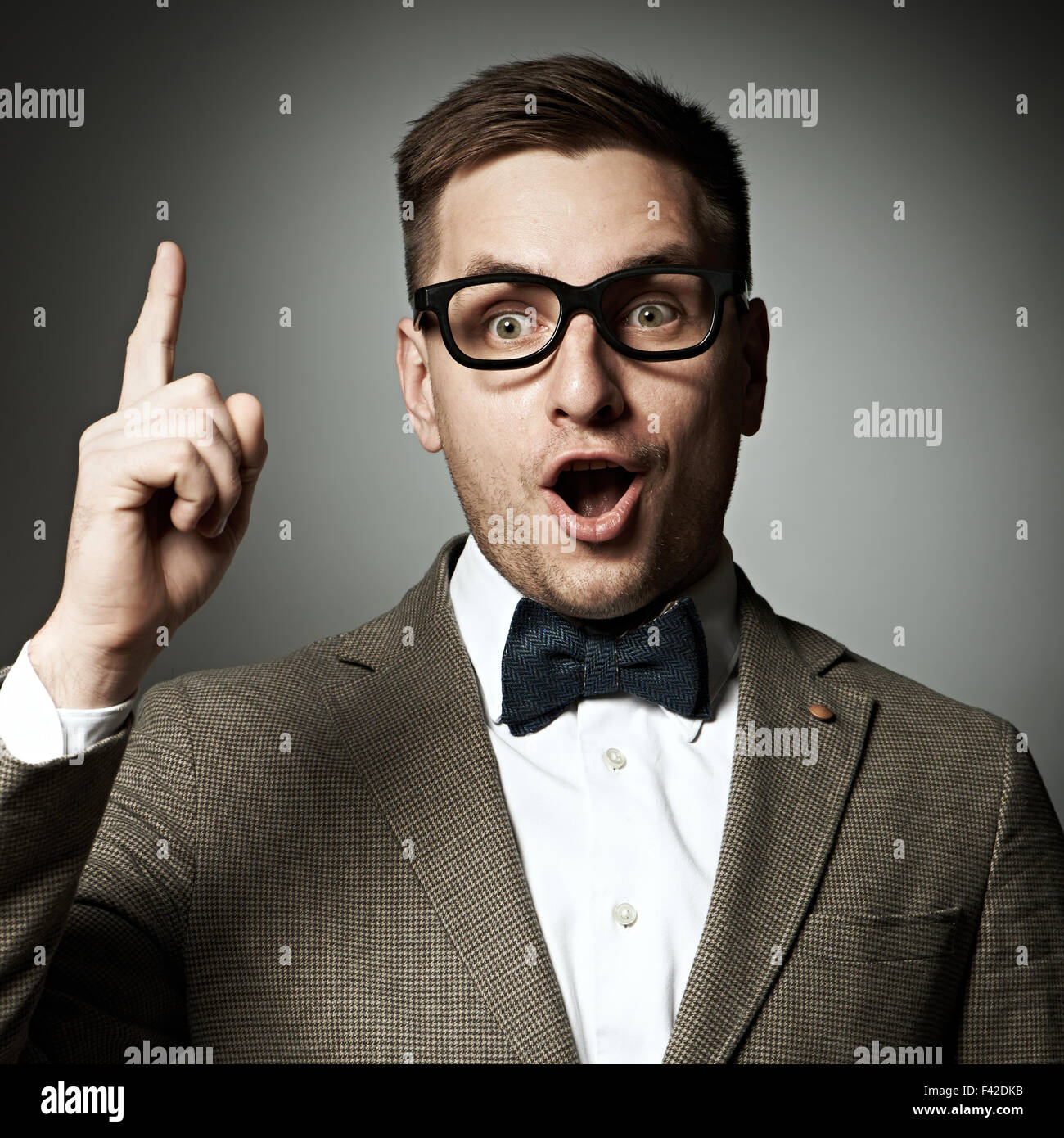 Confident nerd in eyeglasses and bow tie Stock Photo - Alamy